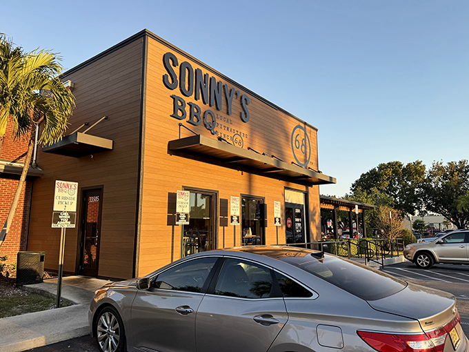 The wooden facade of Sonny's BBQ stands like a beacon of smoky promise against the Florida sky. No fancy frills needed when what's inside speaks volumes.