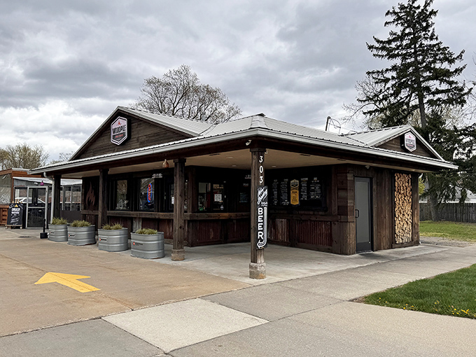 The rustic wooden exterior of Woodpile BBQ Shack promises what every barbecue lover knows: the less fancy it looks, the better the meat tastes.