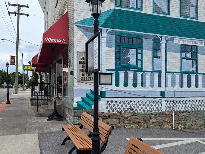 The iconic red awning of Mamie's beckons like a culinary lighthouse on Martinsburg's main street, promising homestyle comfort that big-city eateries spend millions trying to fake.
