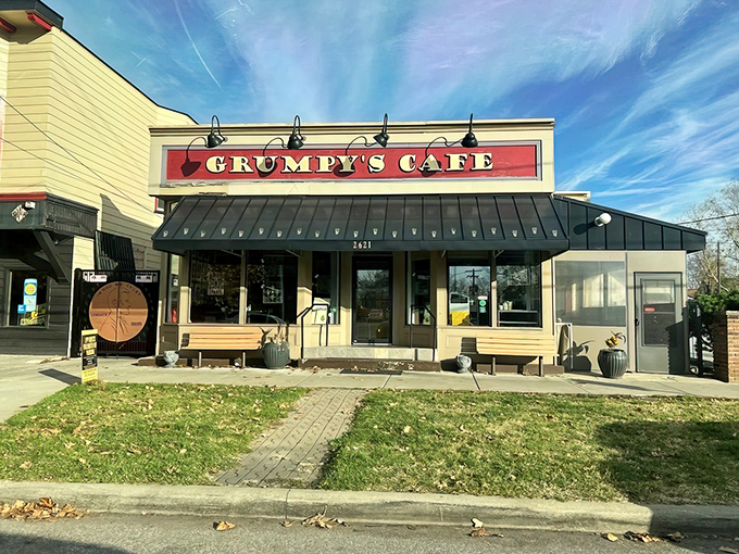 Sunshine meets comfort food at Grumpy's Cafe, where the cheerful yellow exterior and bold red sign promise a breakfast experience worth getting out of bed for.