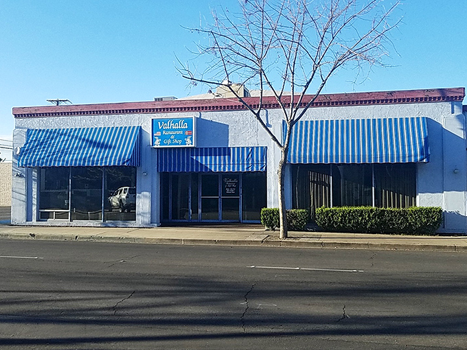 That iconic blue-and-white exterior with red trim isn't just eye-catching&mdash;it's a time portal to when dining out was an event worth dressing up for.