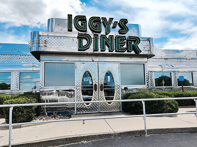 The stainless steel exterior of Iggy's gleams like a time capsule from the 1950s, beckoning hungry travelers with its unmistakable roadside charm.