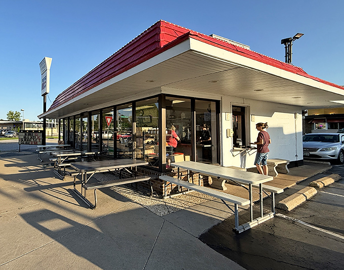 The classic red-roofed drive-in beckons like a time machine to simpler days when great burgers didn't need fancy packaging.