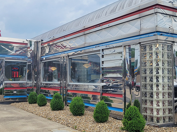 The gleaming stainless steel exterior of Maddy's Diner 23 shines like a time machine to the golden age of roadside Americana.