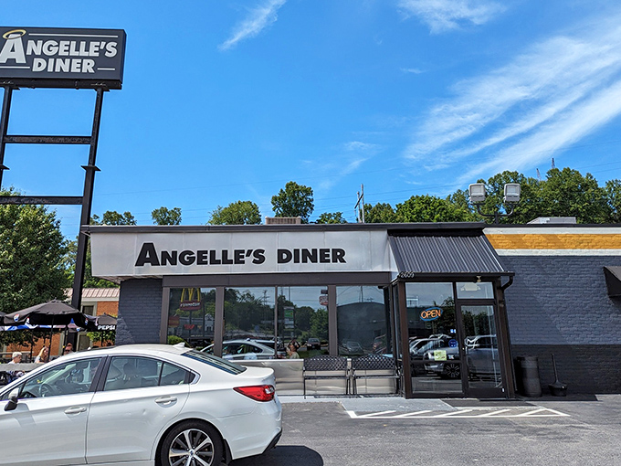 The blue-and-white beacon of Angelle's Diner stands proud against the Virginia sky, promising comfort food that'll make your taste buds stand at attention.