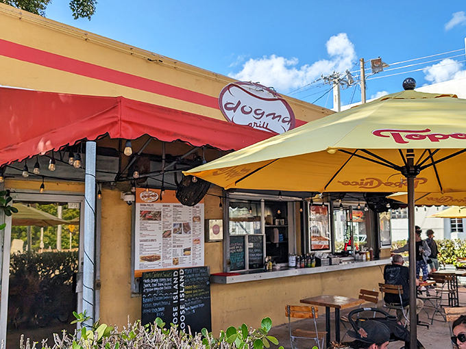 That cheerful yellow exterior isn't just paint – it's a beacon calling hungry souls to hot dog nirvana.