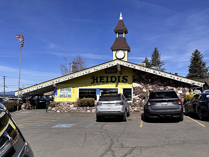 The Swiss chalet meets mountain lodge architecture of Heidi's stands proudly against Tahoe's blue sky, beckoning hungry travelers with its iconic clock tower.
