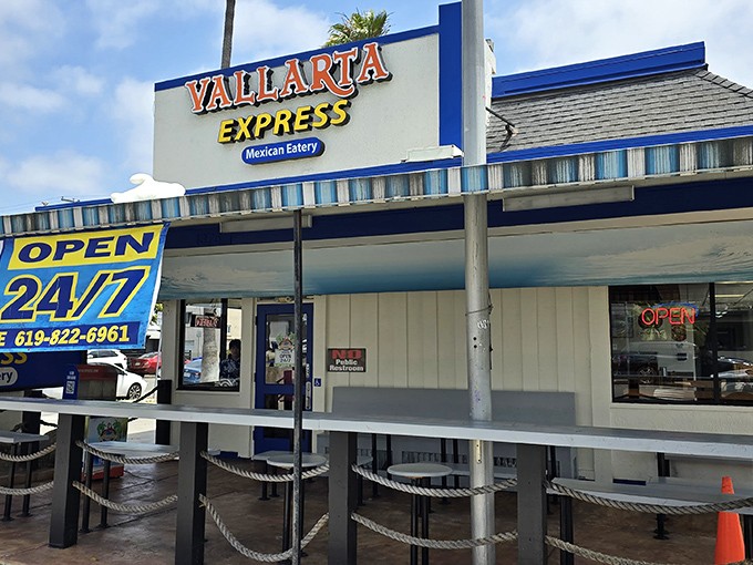 The blue and yellow beacon of Vallarta Express stands proud on Garnet Avenue, promising 24/7 Mexican food salvation for hungry San Diegans.