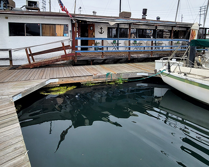The floating charm of Chowder Barge welcomes seafood lovers with weathered wooden planks and American flag&mdash;nautical dining that actually bobs with the tide.