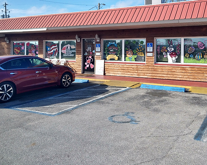 The unassuming exterior of The Biscuit Barn proves once again that the best breakfast spots often hide behind modest facades. Those colorful window paintings promise delicious things inside.