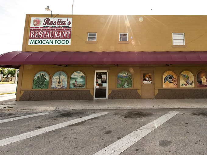 The unassuming tan exterior with vibrant painted windows tells you everything: this isn't about flash, it's about flavor. Authentic Mexican awaits inside.