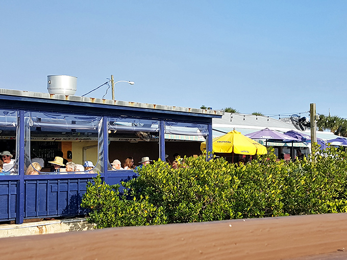 The weathered wooden exterior with its gradient blue "JB" sign isn't trying to impress anyone&mdash;which is exactly how you know the food inside will be spectacular.