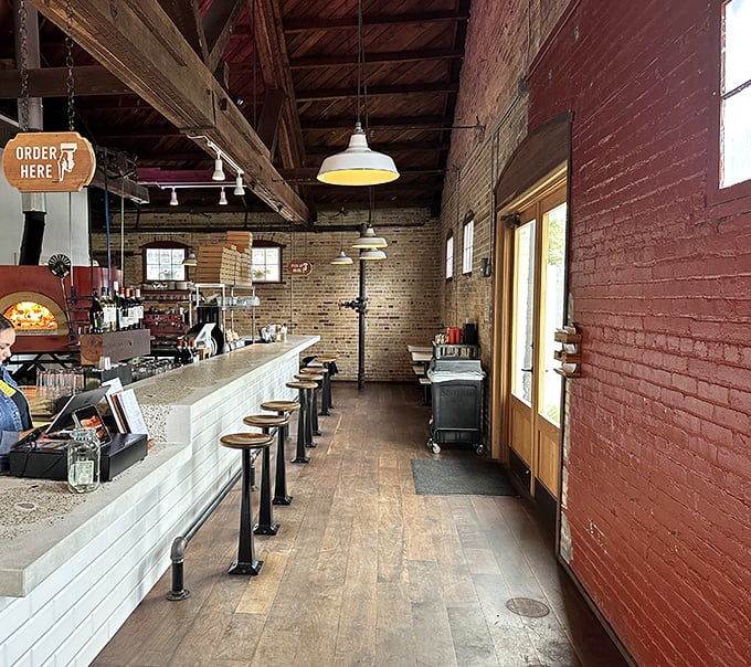 The rustic brick exterior of Humble Wood Fire beckons like an old friend, promising warmth and deliciousness within its walls.