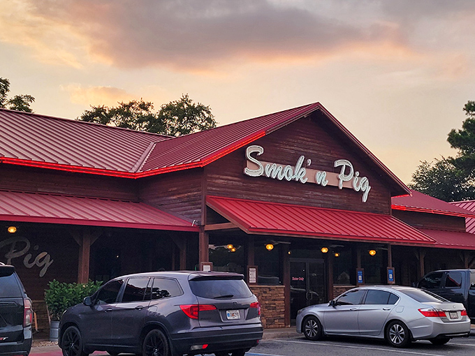 The rustic wooden exterior with its signature red roof isn't just inviting&mdash;it's practically a smoke signal to hungry travelers passing through Valdosta.