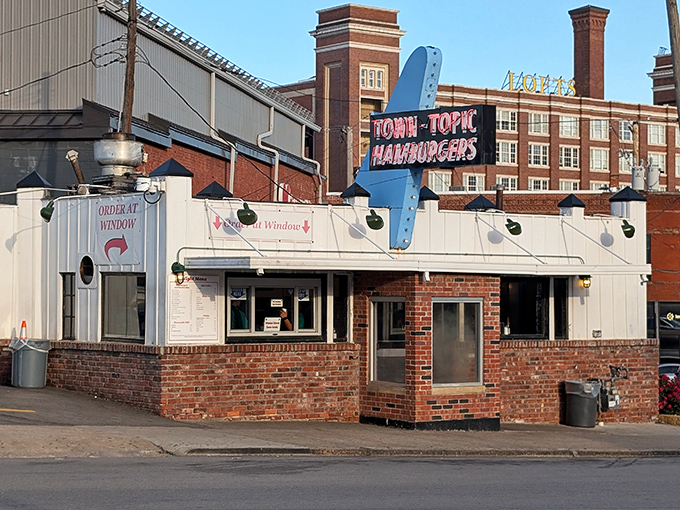 The white brick diner with its iconic blue arrow sign stands like a time capsule on Broadway Boulevard&mdash;a beacon of burger bliss in Kansas City.