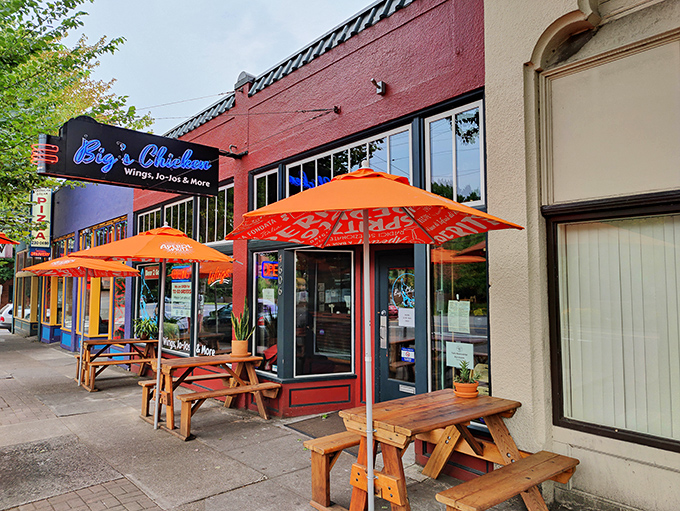 Big's Chicken's vibrant red exterior with those cheerful orange umbrellas is like a beacon calling to hungry souls on Portland's streets. Picnic tables await your chicken-induced happiness.