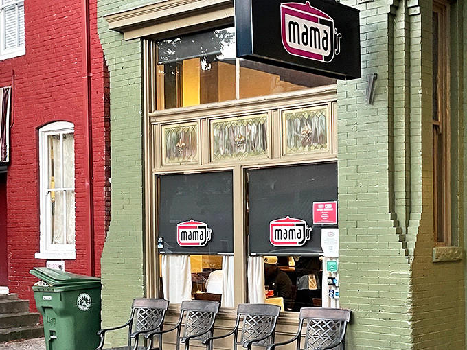 The unassuming green brick exterior of Mama J's belies the culinary treasures within—like finding a Michelin star restaurant disguised as your favorite aunt's house.