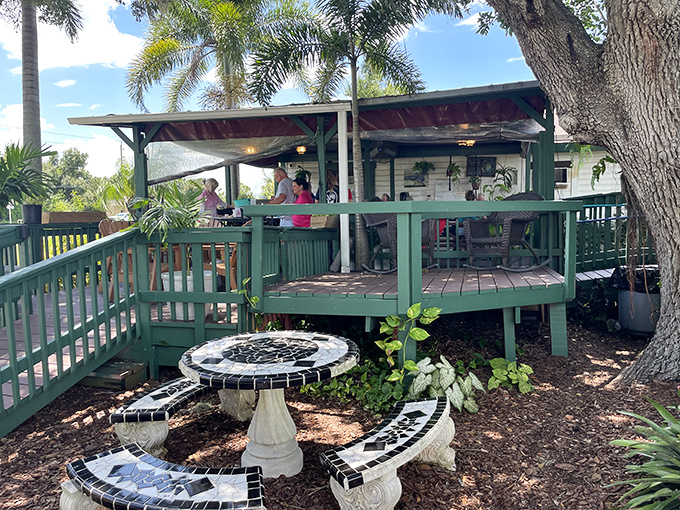 Old Florida charm isn't manufactured here—it's marinated over decades. This weathered cracker house with teal trim promises seafood authenticity without pretension.