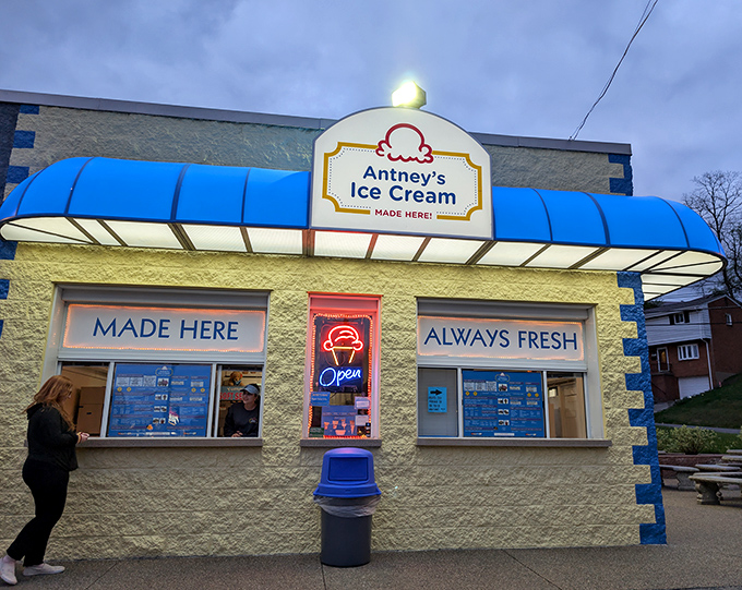 The cheerful yellow building with bright blue accents stands like a beacon of sweet hope in Pittsburgh, promising handcrafted frozen delights.