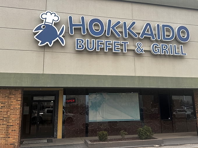 The blue fish chef logo welcomes hungry patrons like a culinary lighthouse guiding ships to shore. Hokkaido's unassuming exterior hides treasure within.