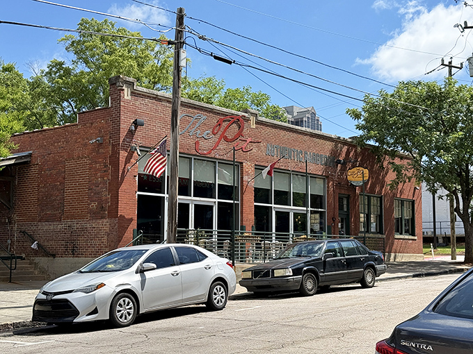 The brick fortress of flavor stands proudly on Davie Street, its unassuming exterior hiding the smoky treasures within. North Carolina barbecue paradise awaits.
