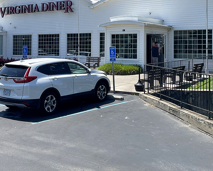 The iconic white clapboard exterior with bold red lettering promises Southern comfort before you even step inside. A roadside beacon of deliciousness.