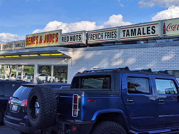 The iconic blue and white exterior of Gene & Jude's stands as a beacon for hot dog pilgrims, its vintage signage promising simple pleasures done right.