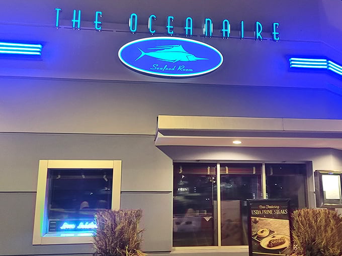 The blue glow of The Oceanaire's iconic sign promises maritime delights within&mdash;like a lighthouse guiding hungry sailors to culinary treasure.