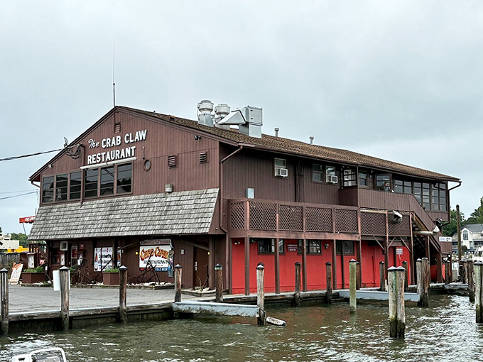 The Crab Claw stands proudly over the water like a rustic sentinel of seafood, its weathered exterior promising authentic Maryland flavors within.