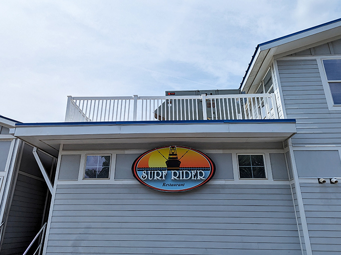 The iconic Surf Rider sign promises seafood paradise &ndash; like a coastal lighthouse guiding hungry travelers home.