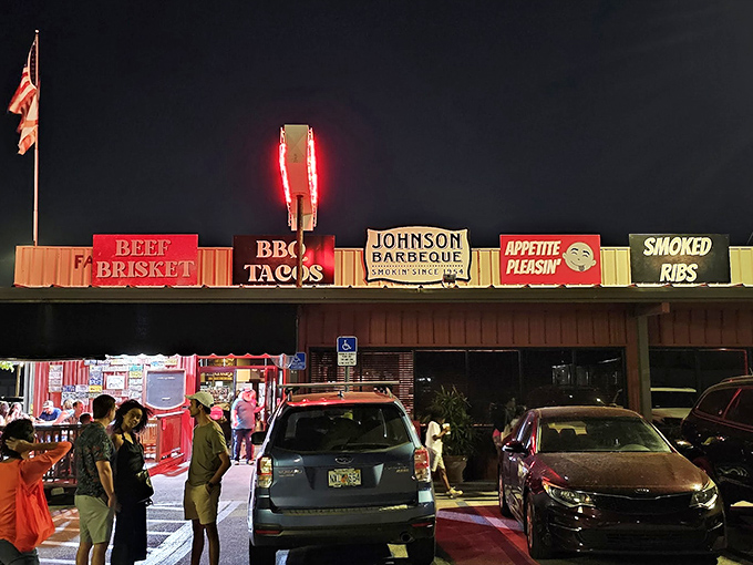 The neon glow of Johnson Barbeque's signage cuts through the night like a beacon for hungry souls. BBQ tacos, beef brisket, and smoked ribs&mdash;the signs tell you everything you need to know.