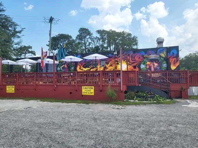 The vibrant murals adorning this unassuming BBQ joint are like a smoke signal to your stomach: extraordinary flavors await inside.