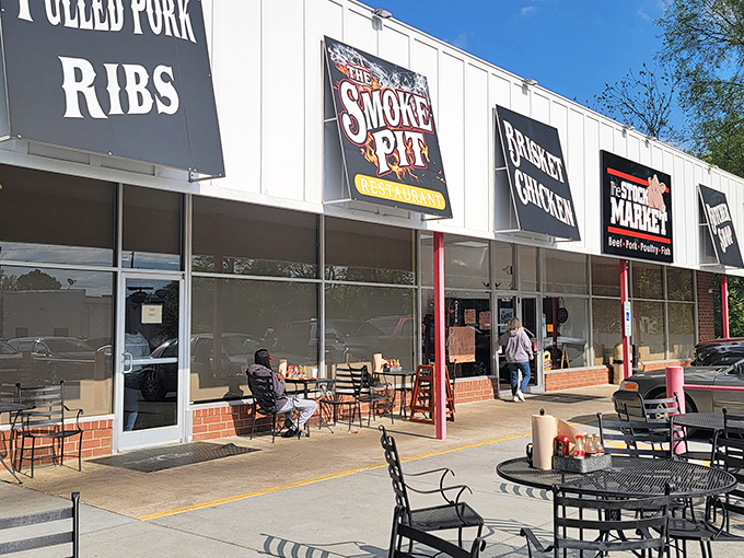 The unassuming storefront speaks the universal language of BBQ – big bold signs promising meaty delights that'll make your car practically park itself.
