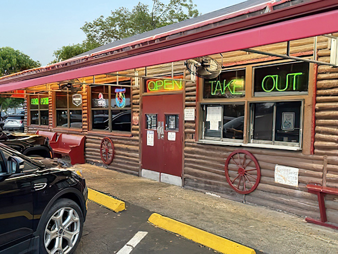 The neon glow of Shiver's BBQ sign is like a smoky lighthouse guiding hungry souls to barbecue paradise. No fancy frills, just the promise of meaty delights within.