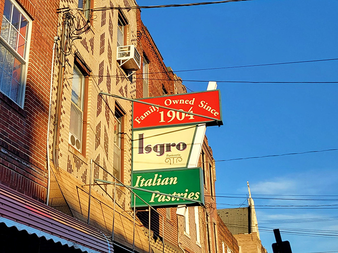 The teal awning of Isgro Pastries has been a beacon of sweetness in South Philly since 1904. Some architectural trends come and go, but cannoli is forever.
