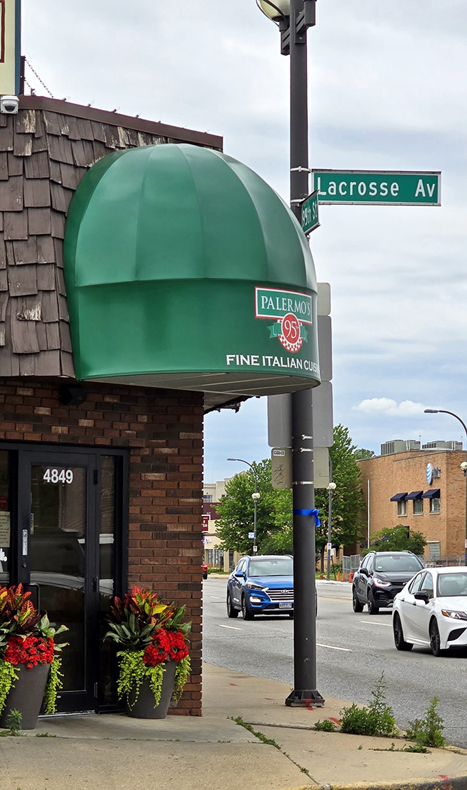 That iconic green awning at 95th and Lacrosse isn't just a landmark&mdash;it's a promise of Italian delights waiting inside. The flower planters add a homey touch.