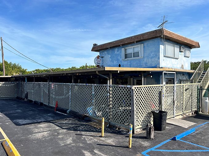 The unassuming blue exterior of Alabama Jack's stands as a beacon to seafood lovers who know that sometimes the best meals hide in plain sight.
