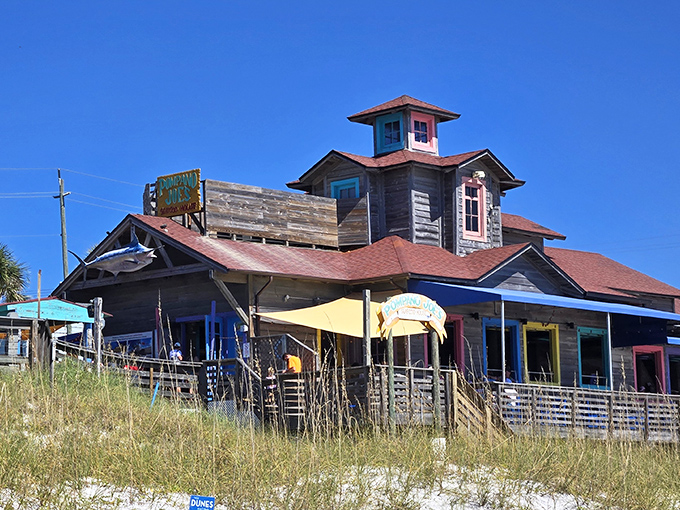 Pompano Joe's weathered wooden exterior isn't trying to impress anyone&mdash;yet somehow manages to charm everyone with its colorful Caribbean-inspired architecture perched right on the dunes. 