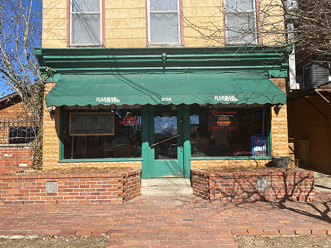 The unassuming yellow exterior with its emerald green awning doesn't scream "culinary destination," but that's exactly what makes this Marietta gem so special.