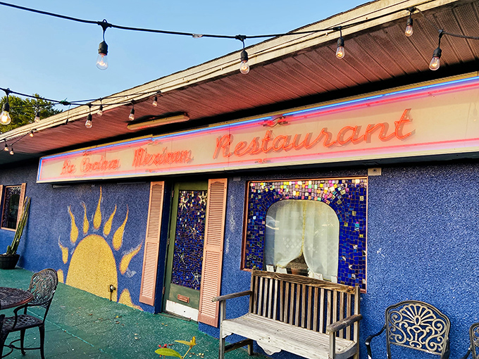 The electric blue exterior of La Cocina isn't just a building—it's a mood announcement. Those string lights promise a fiesta before you even reach for the door handle.