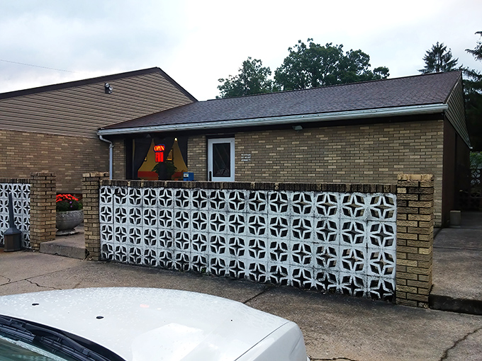The unassuming exterior with its vintage decorative concrete wall is like finding a rare vinyl record in your uncle's attic&mdash;unremarkable until you discover what's inside.