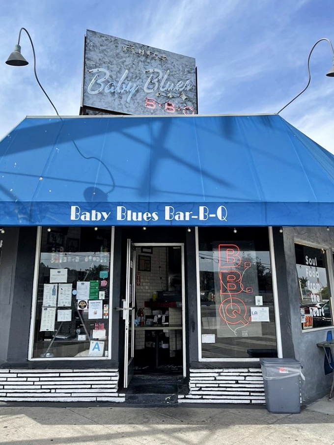 The blue awning of Baby Blues BBQ beckons like a smoky siren call to Venice Beach carnivores seeking refuge from kale smoothies.