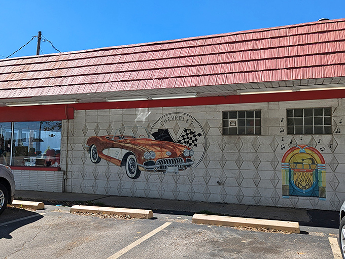 The classic red roof and vintage signage aren't just decoration—they're a time portal to when Elvis was king and milkshakes came with the metal mixing cup.