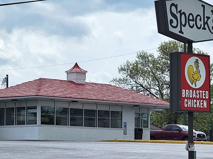 Speck's iconic red roof and vintage sign stand as a beacon of hope for the hungry traveler. Some architectural wonders house priceless art; this one houses priceless chicken.