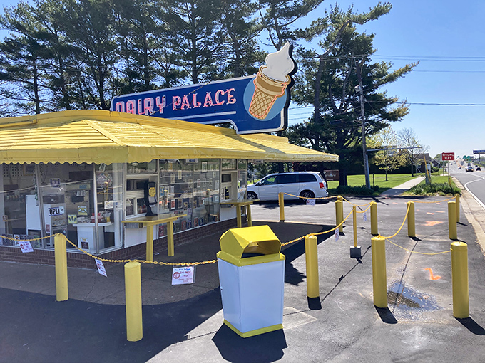 The iconic Dairy Palace stands like a beacon of frozen happiness, its yellow awning and ice cream cone sign promising sweet relief from everyday life.