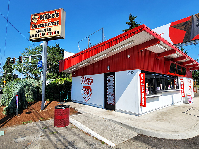The red and white facade of Mike's Drive-In stands like a time capsule of Americana, beckoning hungry travelers with promises of burgers and bliss.