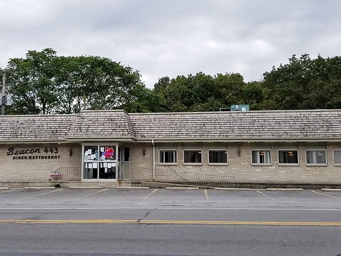 The classic roadside sign for Beacon 443 stands as a welcoming sentinel, promising "Family Dining" that generations of Pennsylvanians have come to trust.