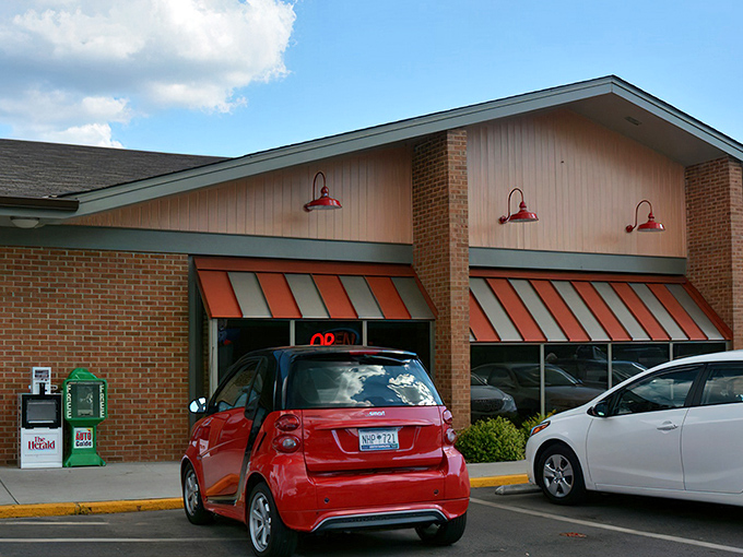 The unassuming brick exterior with orange-striped awnings promises no frills, just honest-to-goodness food that keeps locals coming back day after day.