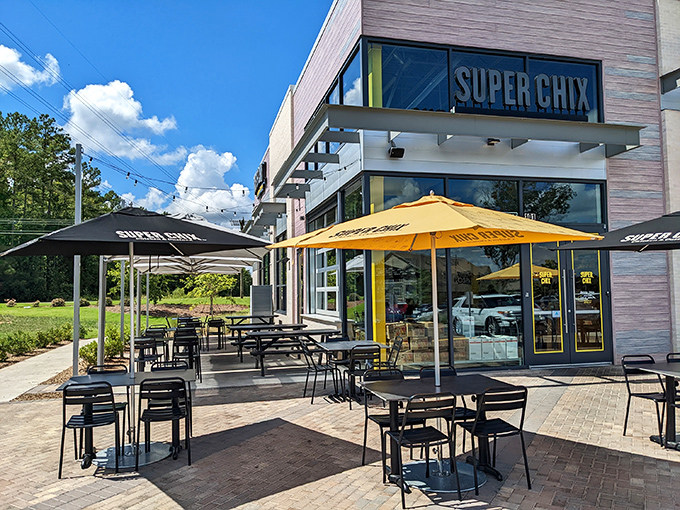 Super Chix's modern exterior with those cheerful yellow umbrellas isn't just inviting&mdash;it's practically waving you in for a chicken revelation.