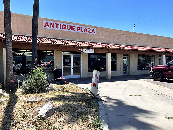The unassuming exterior of Antique Plaza in Mesa hides a wonderland of vintage treasures. Like a time-travel portal disguised as a strip mall storefront!